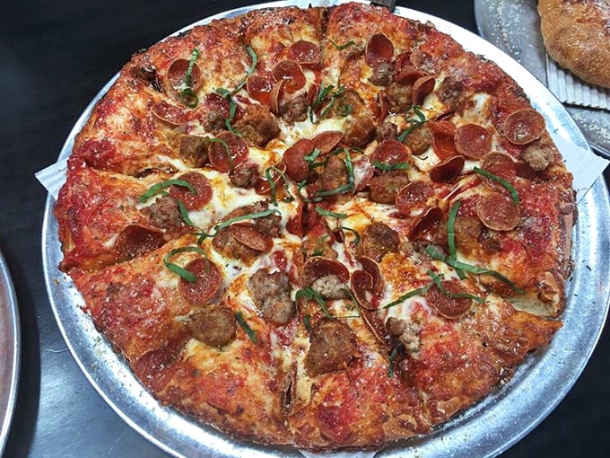 The Colossal Italian isn't messing around—it's the kind of serious meat-lover's pizza that demands respect and extra napkins.