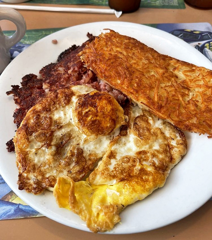 Corned beef hash and eggs – the breakfast equivalent of a warm hug from someone who genuinely doesn't care about your diet plans.