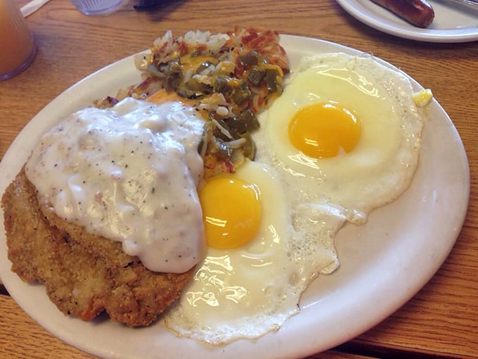 Country fried steak with gravy and sunny-side-up eggs—the breakfast equivalent of a warm hug from your favorite aunt who knows her way around a kitchen.