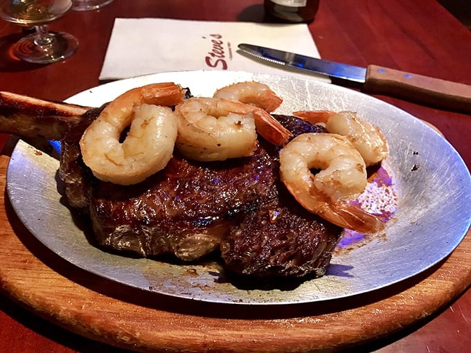 A cowboy steak with jumbo shrimp – proof that sometimes the best surf and turf doesn't need white tablecloths or fancy garnishes.