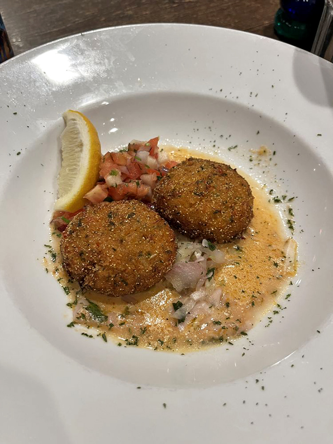 These aren't your average crab cakes – they're mostly actual crab, not breadcrumbs with vague oceanic memories. That sauce? You'll be dreaming about it later.