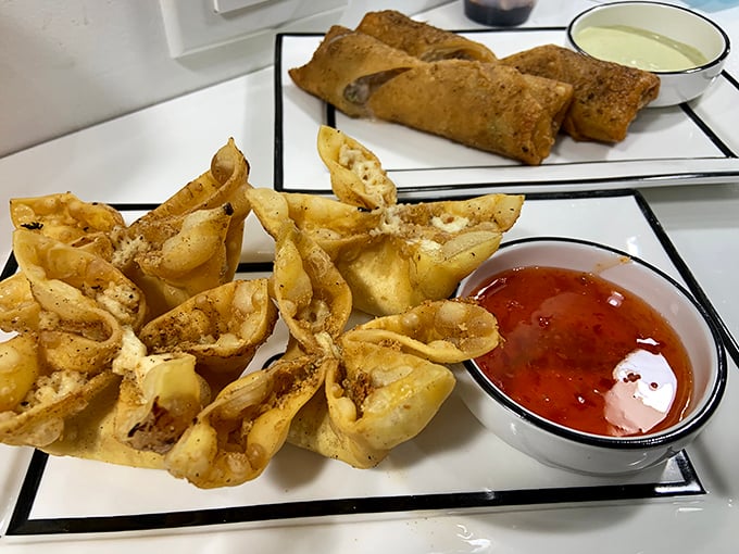 Crispy wonton wrappers cradle delicate filling—like tiny flavor boats sailing to your mouth. Dipping sauce standing by for extra deliciousness!