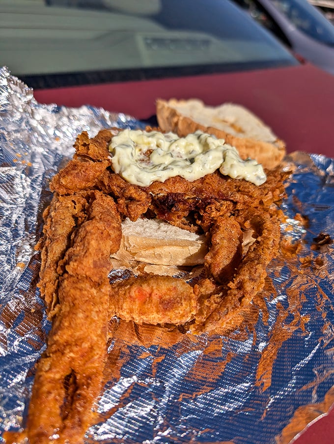 This fried seafood sandwich isn't just a meal—it's an event. The kind that requires multiple napkins and zero shame about the joy on your face.