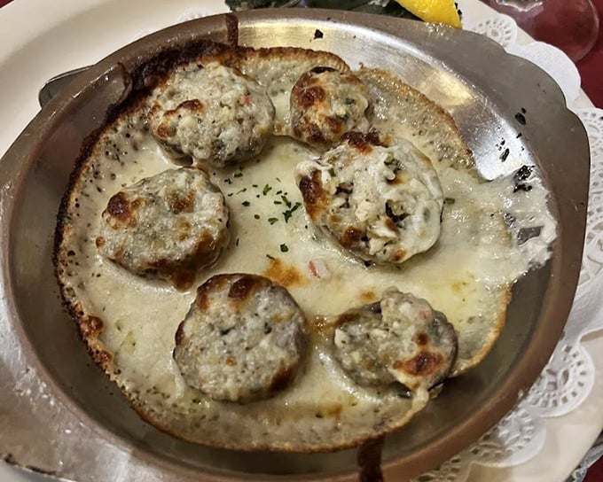 Crab-stuffed mushrooms bubbling with cheese—the kind of appetizer that makes you seriously reconsider the concept of sharing plates.