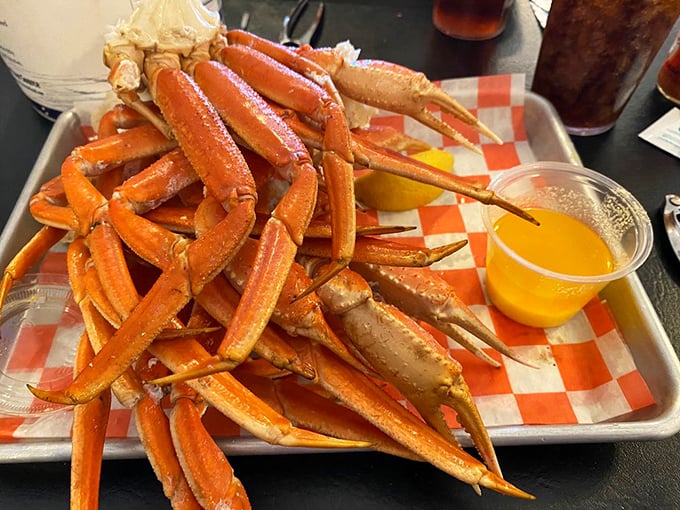 Snow crab legs arranged like nature's perfect eating utensils. The bright orange shells practically scream, "Grab your bib and get cracking!"