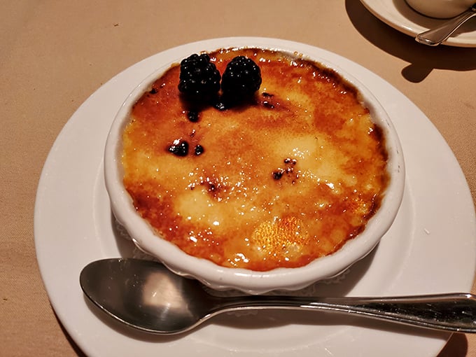The crème brûlée's perfectly torched sugar crust makes that satisfying crack that's music to dessert lovers' ears—nature's most perfect percussion instrument.