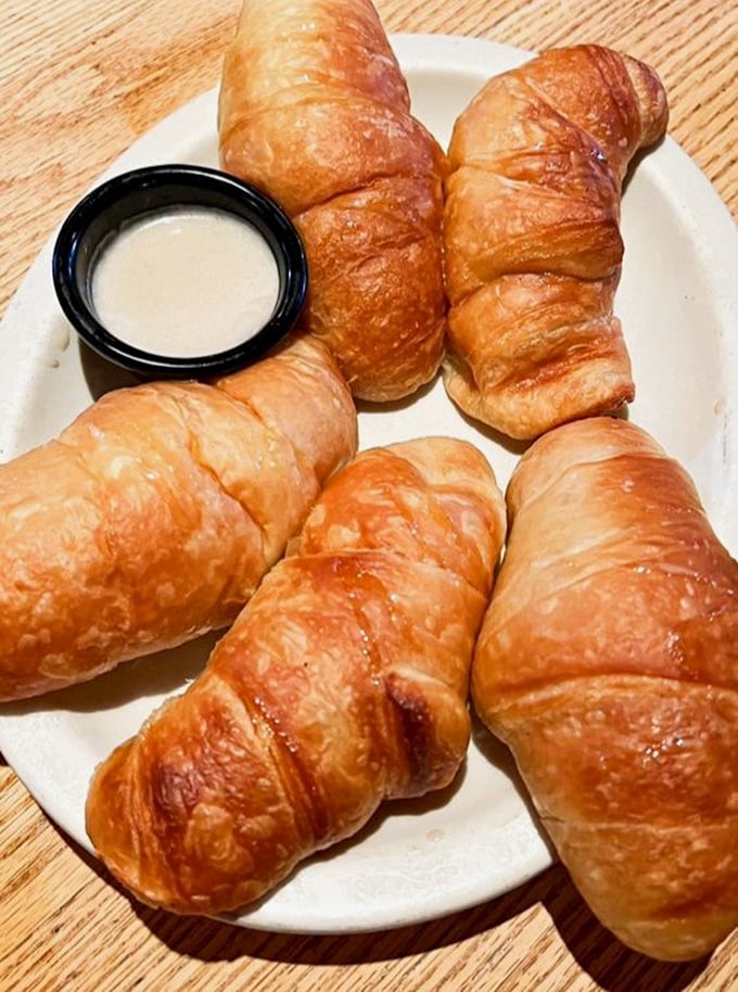 These honey-butter croissants aren't just bread—they're buttery vessels of joy that make waiting for your entrée a pleasure, not a chore.
