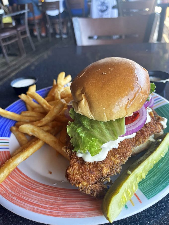 This sandwich doesn't just satisfy hunger—it conquers it. The crispy fish peeks out like it's trying to escape, but you'll catch it.
