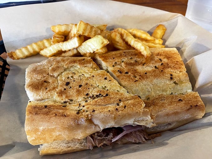 The Cuban sandwich gets the Groupers treatment—pressed to perfection with that ideal ratio of meat, cheese, and pickle that makes you question why you'd eat anything else.