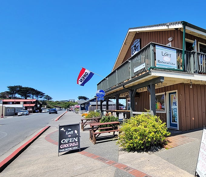 The Loft Restaurant's outdoor seating beckons with the promise of ocean breezes and locally-inspired cuisine – coastal dining at its most authentic.