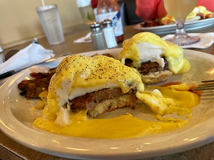 Eggs Benedict so perfectly executed, the hollandaise cascades like a yellow waterfall of buttery goodness. Retirement goals: eating this without checking your cholesterol numbers.