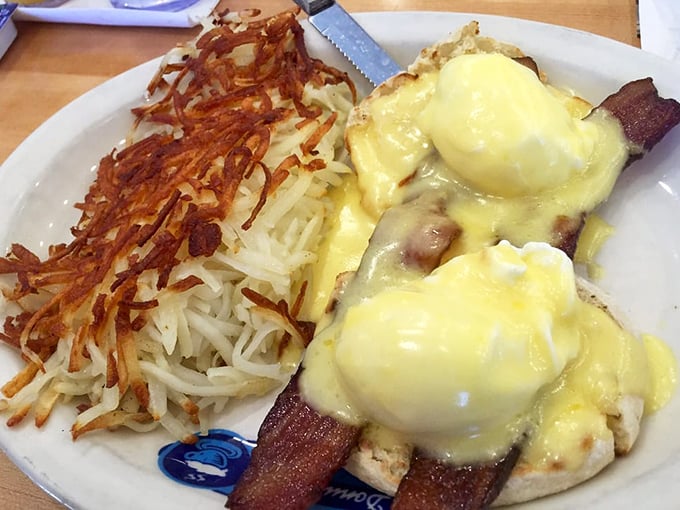 Eggs Benedict with crispy hash browns – breakfast's power couple that makes you wonder why anyone would ever skip the most important meal of the day.