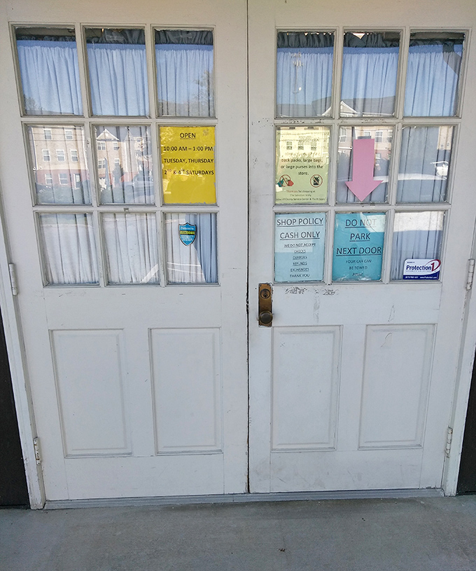 The rules of engagement clearly posted: Cash only, limited hours, and absolutely no parking next door – the thrift store equivalent of "look but don't touch."