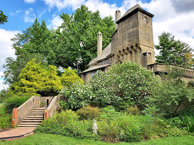Gardens embrace the castle's foundation, softening its concrete edges with nature's touch. Even Mercer knew every castle needs proper landscaping.