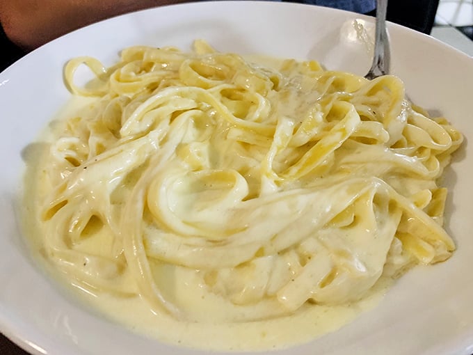 Fettuccine Alfredo so creamy it should come with its own cardiologist's business card – but worth every heavenly, indulgent bite.