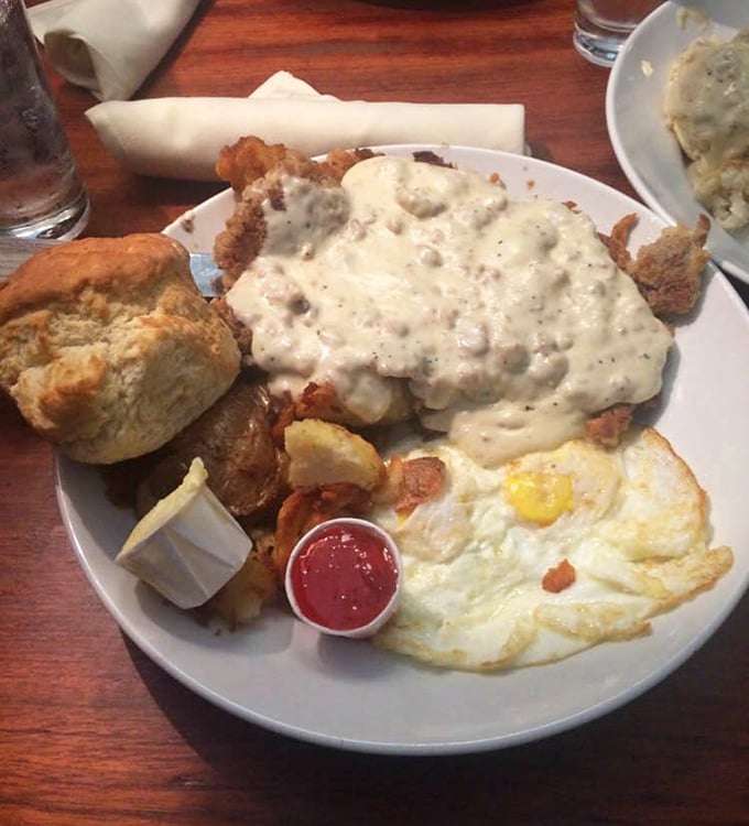 When gravy cascades over chicken fried steak like a waterfall of comfort, you know you've found breakfast nirvana.