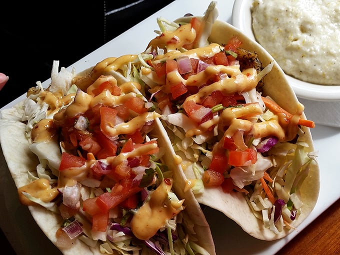 Fish tacos dressed for success with fresh cabbage, pico, and a sauce that should probably run for mayor.