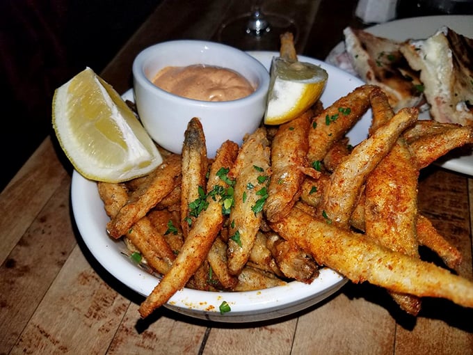 Golden, crispy fish with perfectly seasoned fries – proof that sometimes the simplest dishes, executed perfectly, create the most profound pleasure.