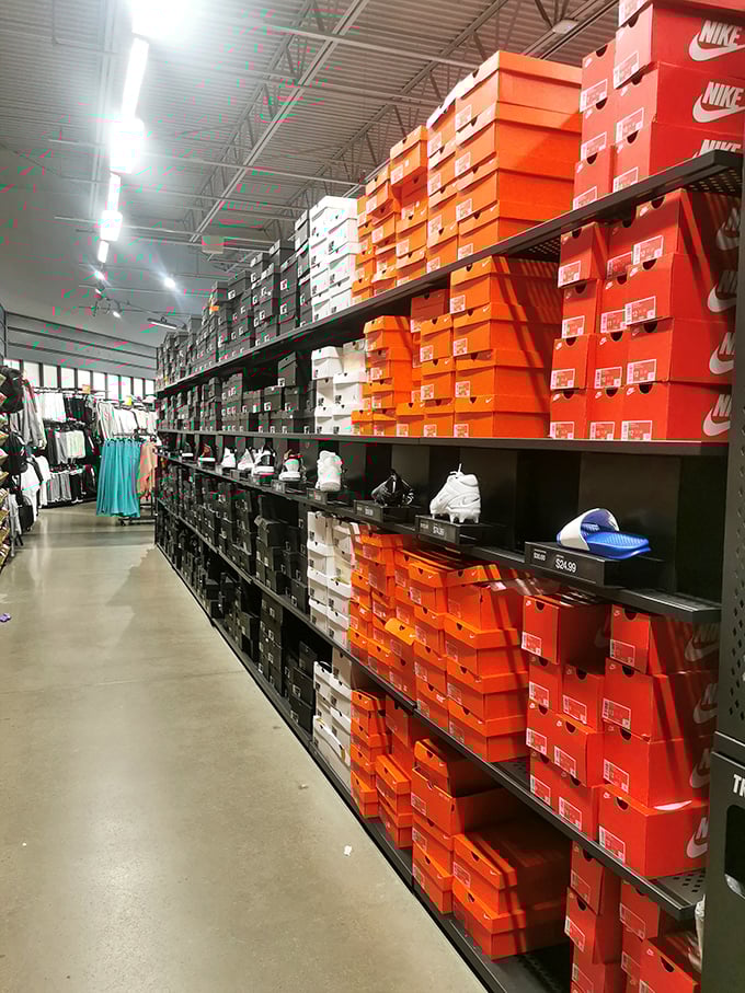 The Nike shrine—where sneakerheads find their holy grail stacked in orange boxes like a temple to athletic fashion.