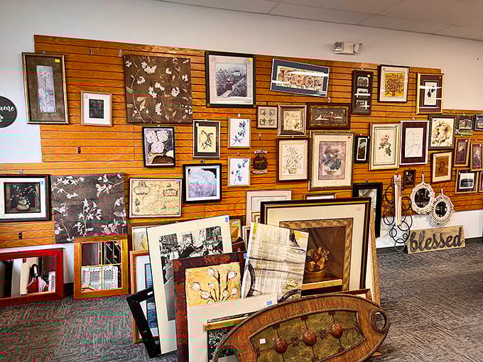 The wall of frames and artwork – a gallery where someone's "it doesn't match the couch" becomes your statement piece.