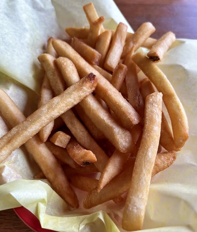 These aren't just french fries—they're golden potato wands that have been perfected through thousands of batches and decades of dedication.