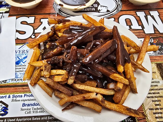 These aren't just french fries—they're golden vehicles purposefully designed for the optimal transportation of gravy from plate to palate. Engineering at its finest.