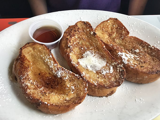 French toast that's had a proper education abroad—thick-cut, golden-brown, and sophisticated enough to make regular bread feel inadequate. 
