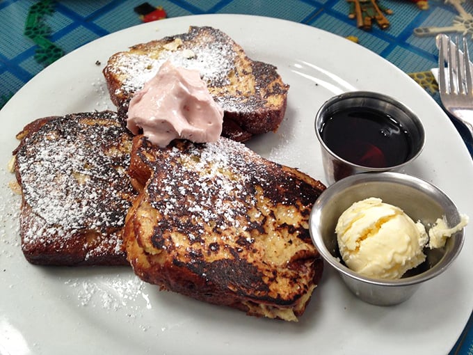 French toast that makes you wonder why you ever settled for lesser breakfast options. That whipped cream isn't just a topping—it's a statement.