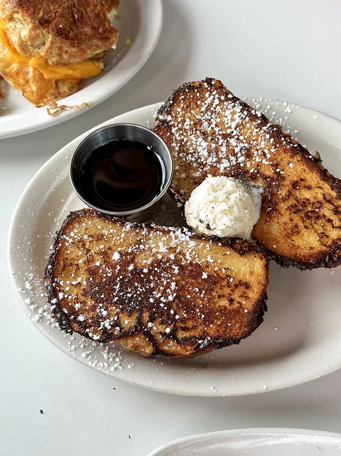 French toast that makes pancakes jealous. Golden-brown, crispy edges giving way to custardy centers—this is breakfast elevated to an art form.
