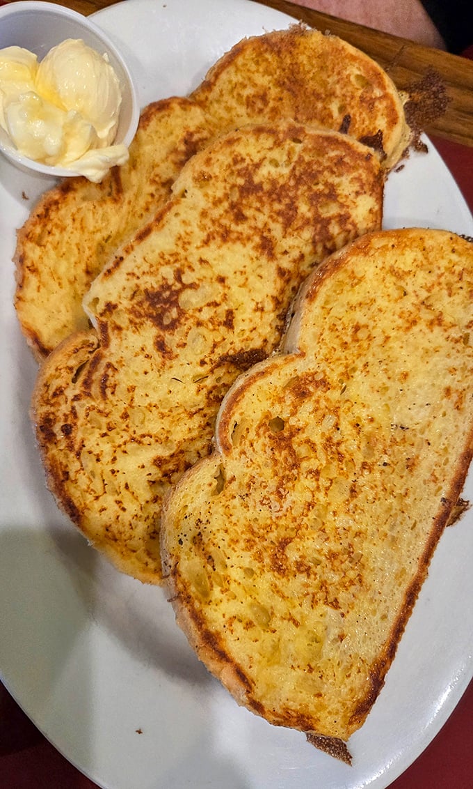 French toast that makes breakfast feel like dessert – golden, crispy edges giving way to custardy centers that practically beg for a drizzle of maple syrup.