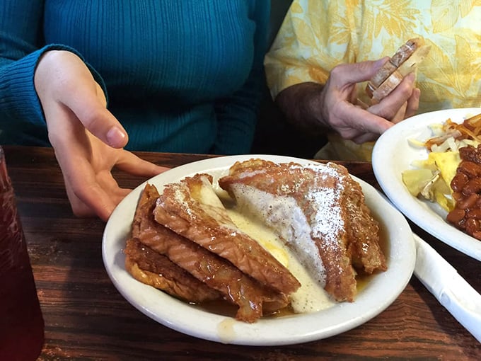 French toast that's achieved the perfect golden-brown exterior while maintaining that custard-like interior—the breakfast equivalent of hitting the lottery.