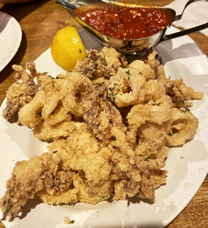 Fried calamari that actually tastes like the sea rather than the fryer – a rare achievement that deserves respect and rapid consumption.