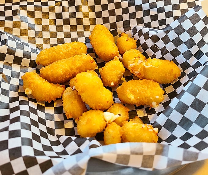 Golden nuggets of joy—these cheese curds have been transformed from humble dairy to crispy, molten treasures worth fighting over.