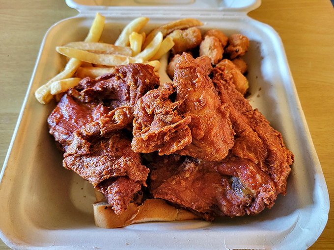 The to-go box might be modern, but what's inside is timeless – crispy, spicy chicken that makes you understand why they put "World Famous" on the sign.