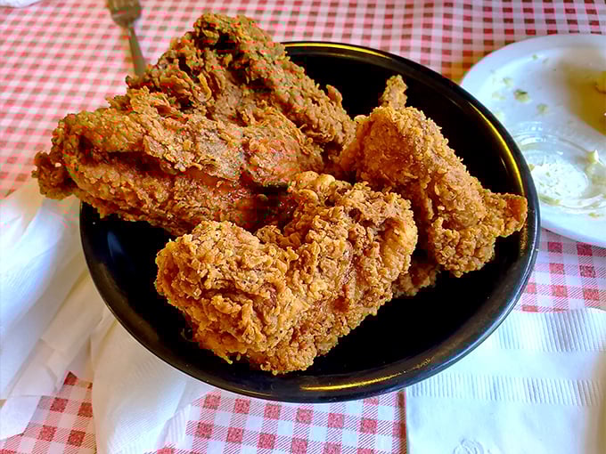 Fried chicken with a crust so perfect it deserves tenure. This isn't just dinner—it's a masterclass in comfort food engineering.