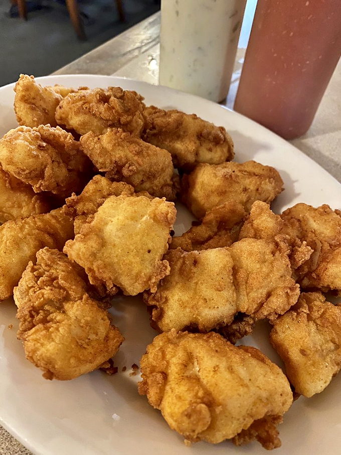 Golden nuggets of fried cod that shatter with each bite – the kind that make you wonder why you'd ever settle for frozen fish sticks.