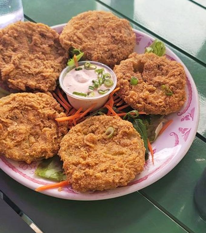 These crispy golden discs aren't just fried green tomatoes—they're Southern tradition given Philly citizenship. Crunchy, tangy perfection awaits.