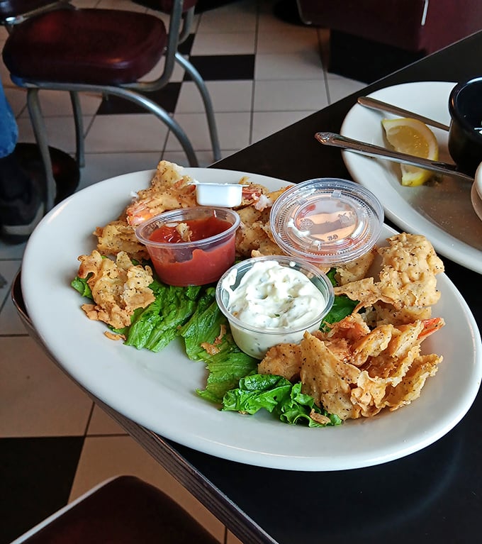 These crispy fried shrimp aren't just appetizers—they're little golden treasures served with dipping sauces worth fighting over.