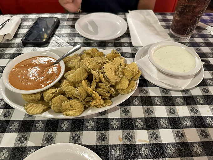 These aren't just fried pickles – they're crunchy little flavor bombs served with dipping sauces that'll have you plotting your next visit before you leave.