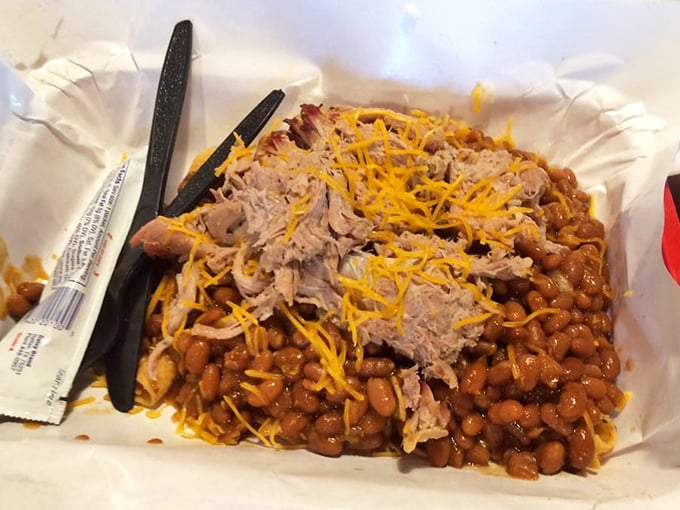 The Frito Pie—where humble corn chips meet smoky pulled pork and beans in a beautiful marriage of textures and flavors.
