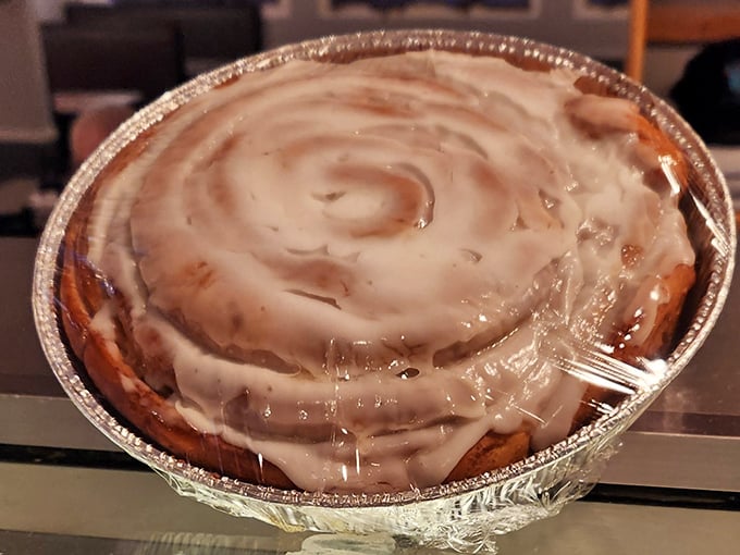 This cinnamon roll isn't just a pastry—it's an architectural achievement. Frosting swirls hypnotize you into forgetting about your diet.