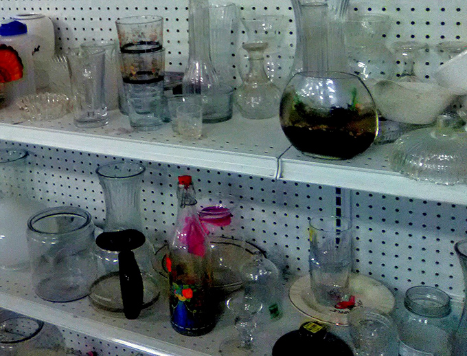 Glassware galore! Crystal, everyday tumblers, and that one weird decorative piece someone's mother-in-law gave them—all waiting for your dinner party debut.