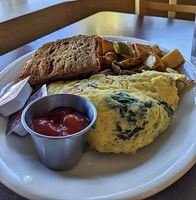 This isn't just an omelet – it's architecture, engineering, and art all on one plate, with toast standing by for support.