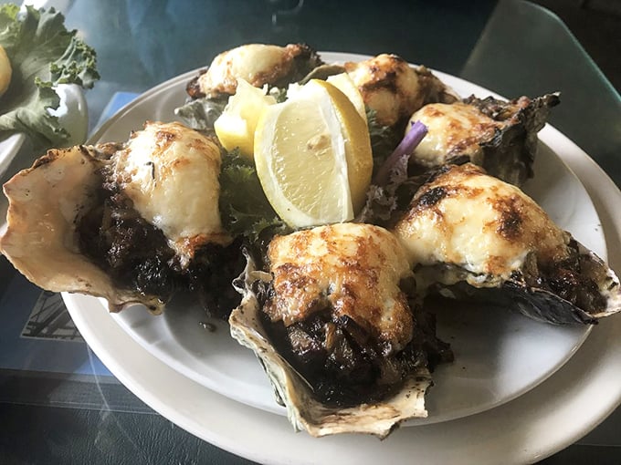 Oysters wearing a blanket of melted cheese and herbs – proof that sometimes playing with perfection actually makes it better. Sea-to-mouth happiness.