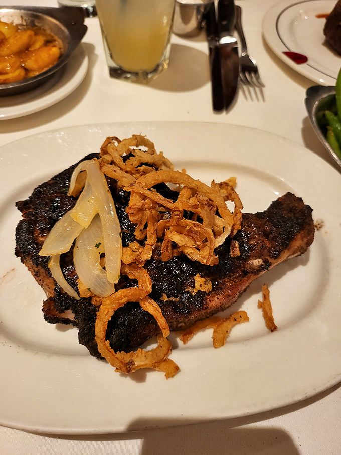 When a pork chop meets crispy onions, magic happens. This isn't just dinner—it's what your taste buds have been dreaming about all day.