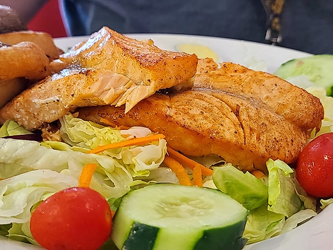 Grilled salmon perched atop a garden of greens. When you want to feel virtuous while still treating yourself royally.
