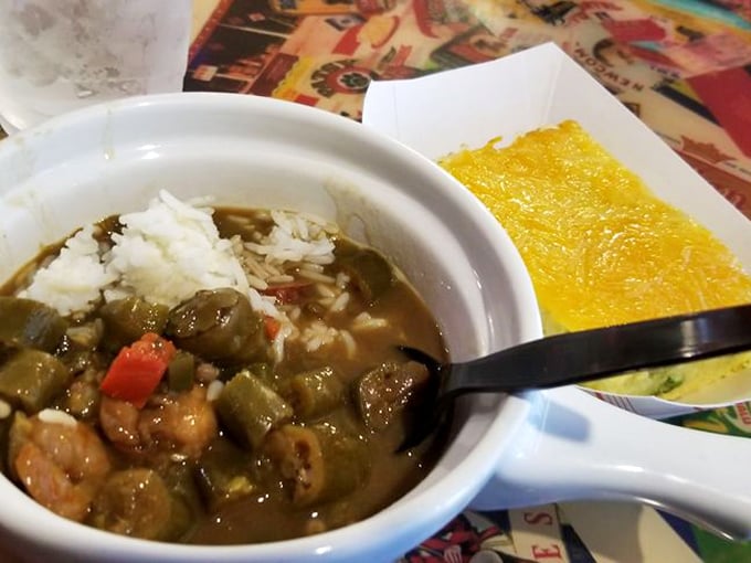 A bowl of gumbo that tells stories with each spoonful – dark, mysterious, and loaded with okra, shrimp, and what looks like a lifetime of flavor development.