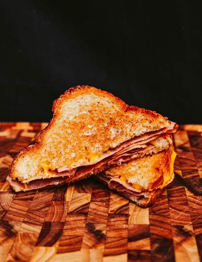 This grilled ham and cheese isn't just a sandwich—it's a perfectly executed comfort classic that would make your grandmother nod in approval.