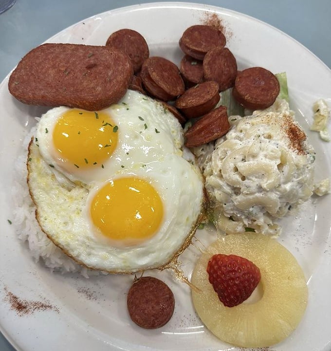 Sunny-side up eggs with Portuguese sausage—a taste of Hawaii that brings island vibes to the Nevada desert.