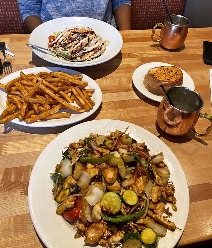 A feast fit for royalty—or just really hungry humans. Stir-fried chicken with vegetables, pasta with grilled chicken, and golden fries that demand attention.